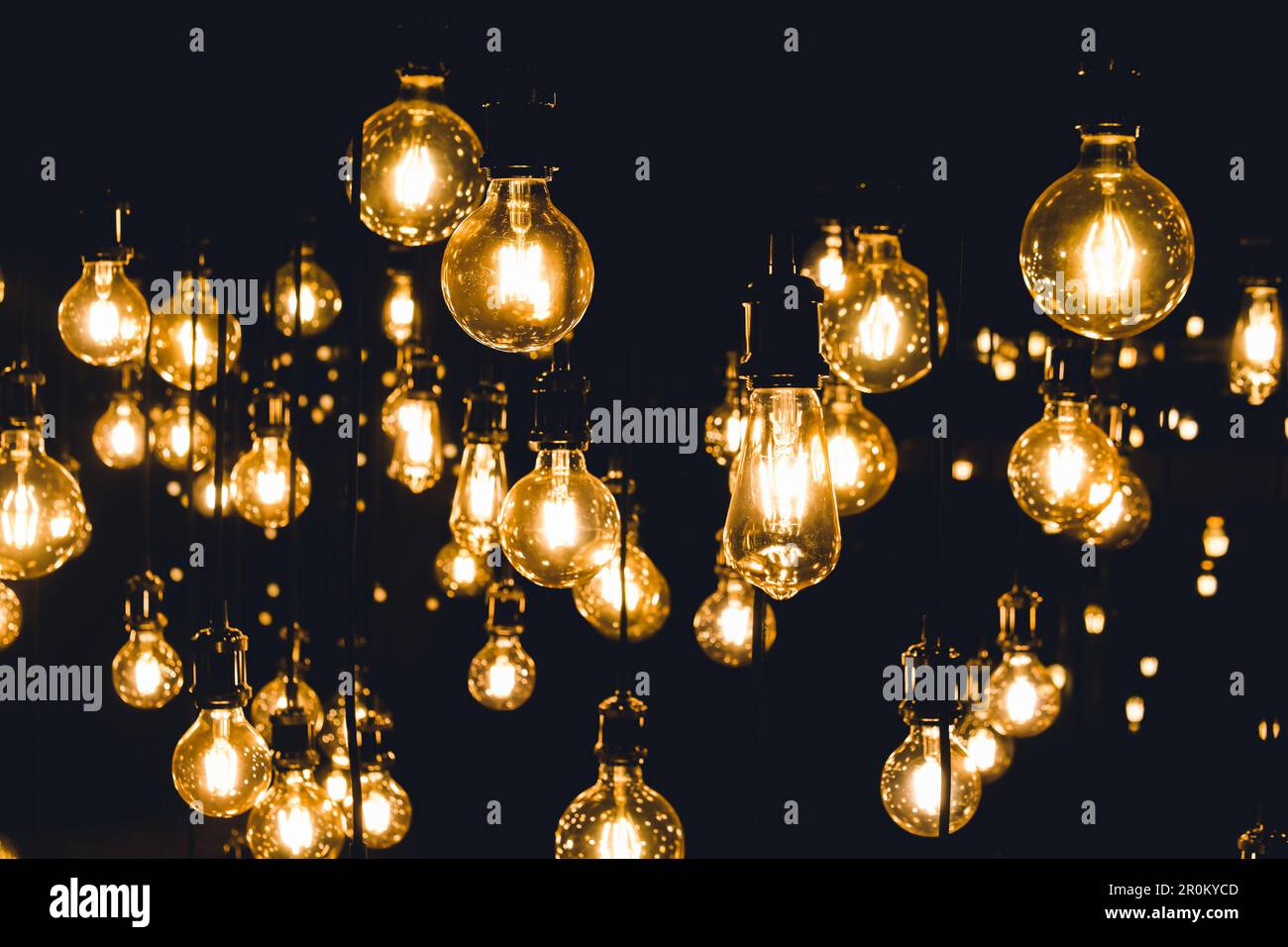 Vintage Retro Old Fashioned Yellow And Orange Light Bulbs Hanging On