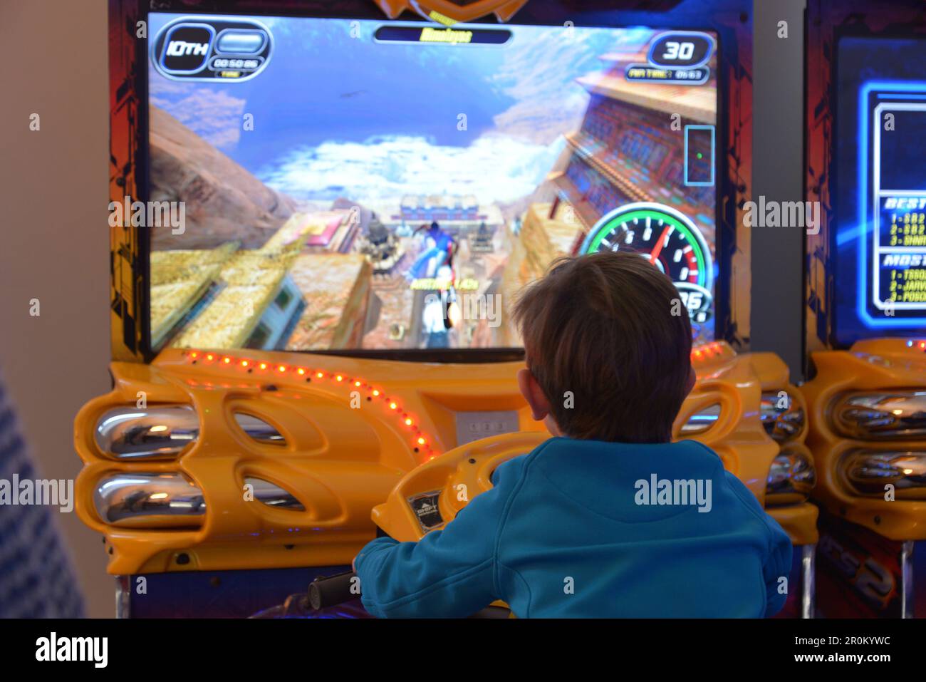 young boy playing video game on big screen Stock Photo - Alamy