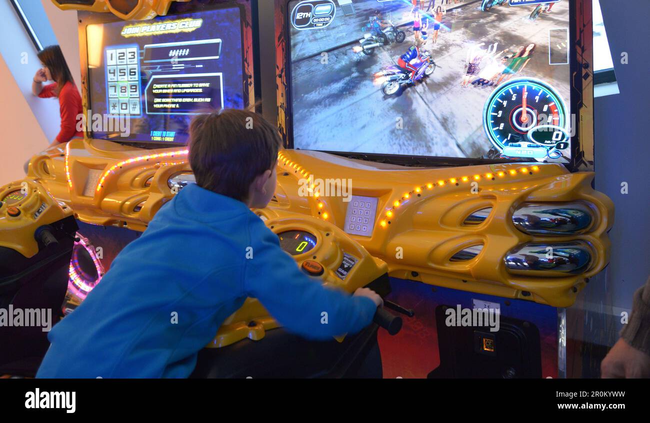 young boy playing video game on big screen Stock Photo - Alamy