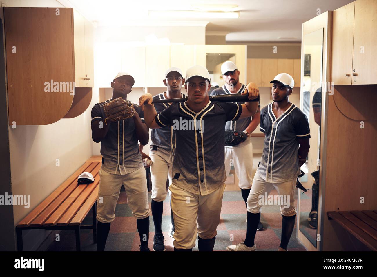 The best teams move together as one. a group of young men walking into ...