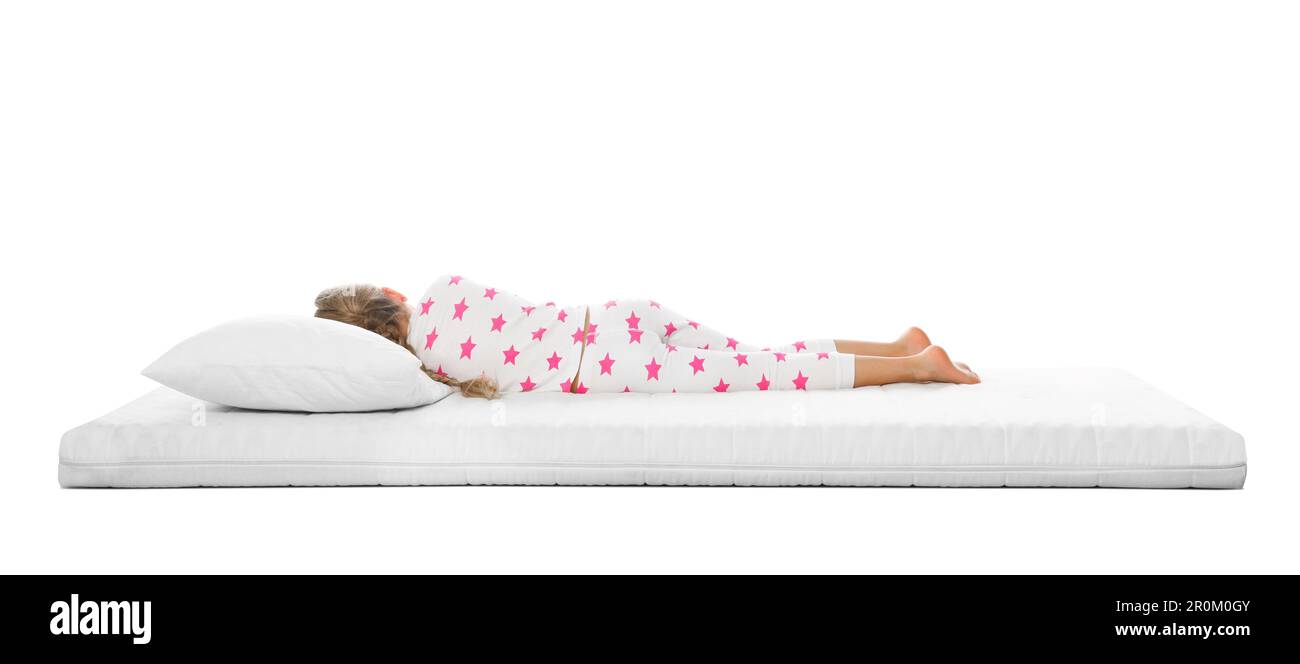 Little girl sleeping on comfortable mattress against white background ...