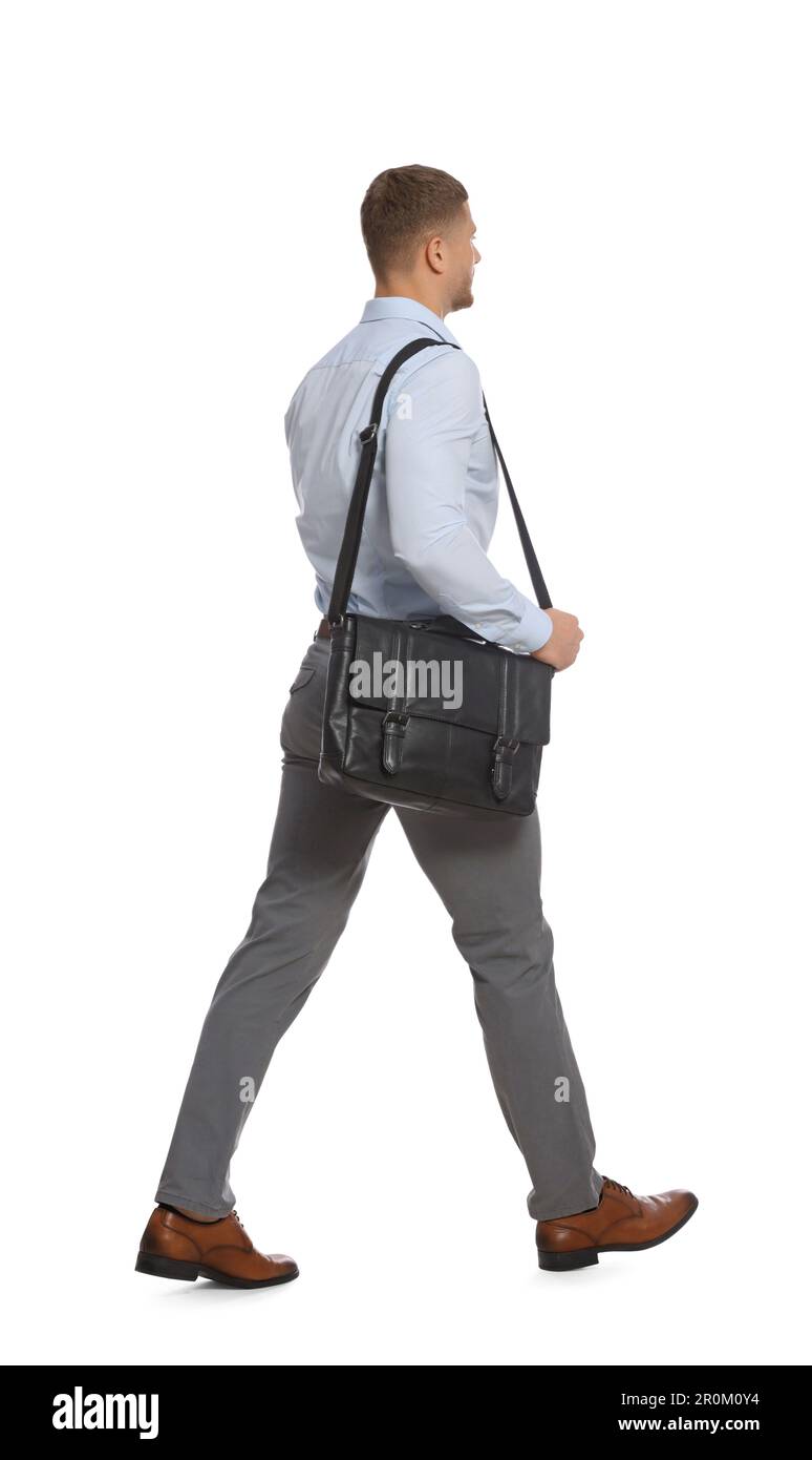 Man with bag walking on white background Stock Photo - Alamy