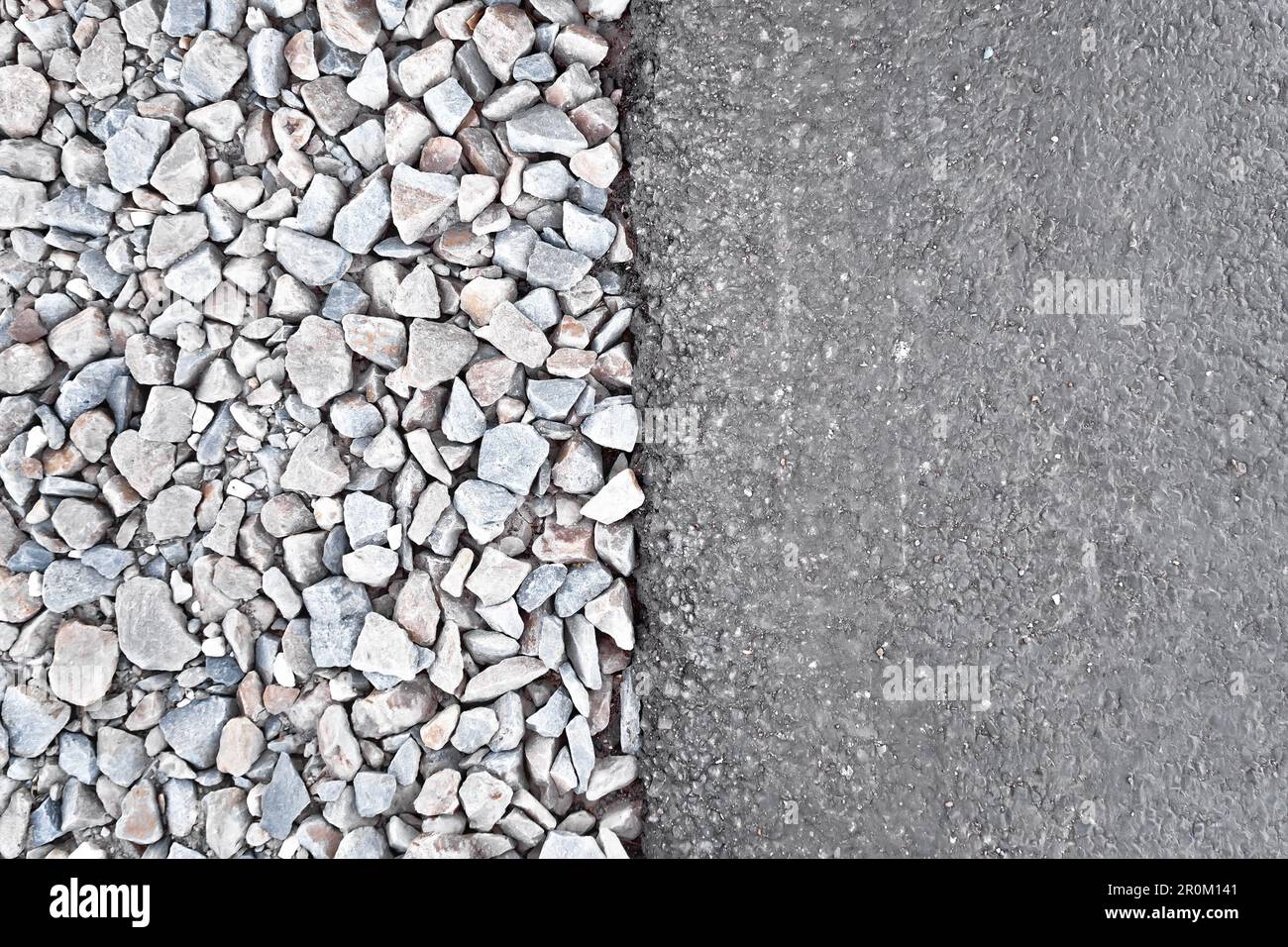 Texture of asphalt and crushed stone of the finished roadbed vertically ...