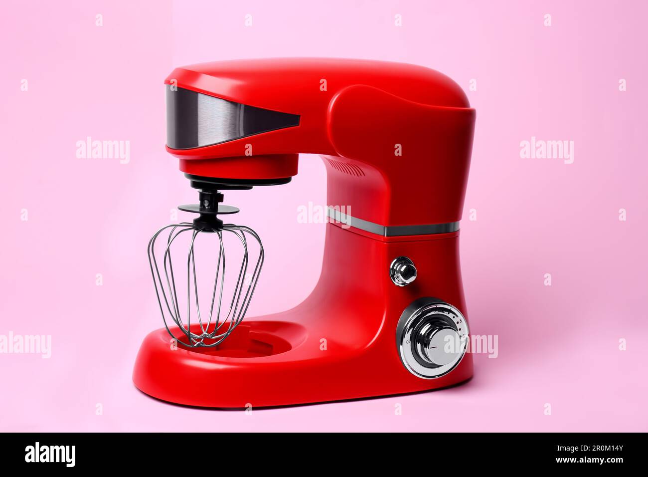 Modern red stand mixer on pink background Stock Photo - Alamy