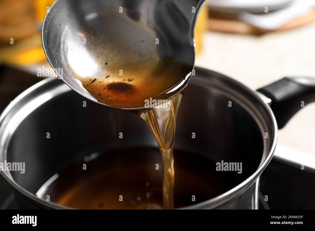 Pouring used cooking oil hi-res stock photography and images - Alamy