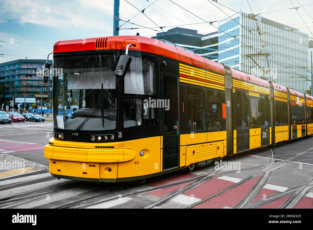 Modern tram on city street. Public transport Stock Photo - Alamy