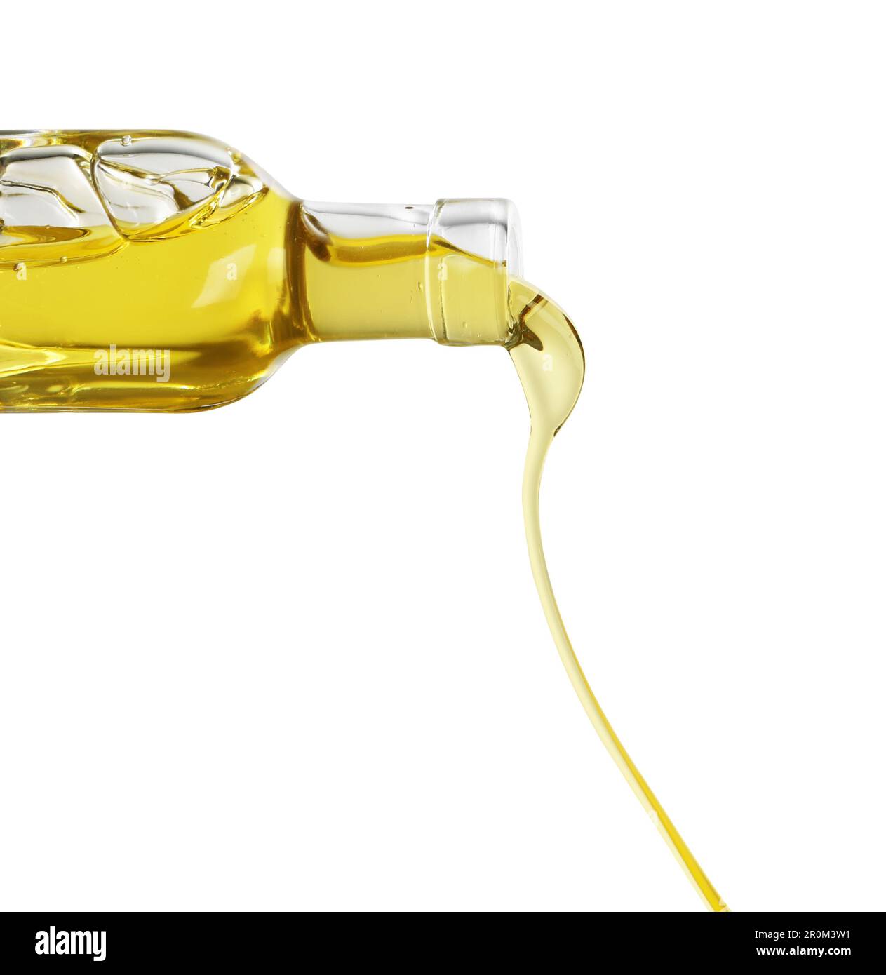 Pouring cooking oil from bottle on white background, closeup Stock ...