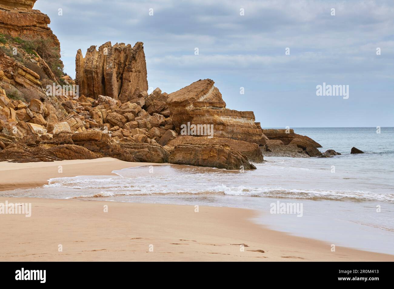 Steep coast and beach at Salema, Parque Natural do Sudoeste Alentejano ...