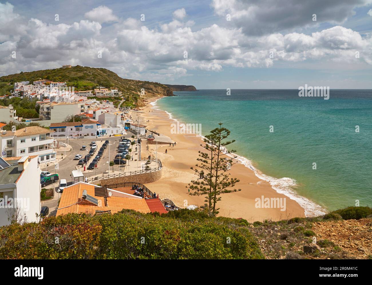 View at the steep coast and beach of Salema, Parque Natural do Sudoeste ...
