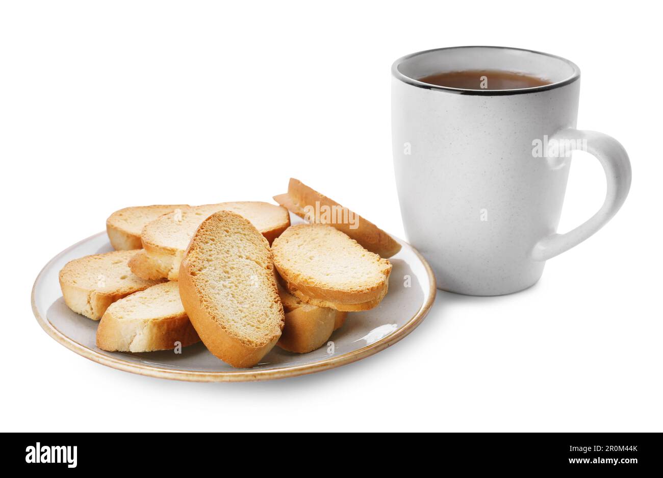 Hard chuck crackers and cup of tea on white background Stock Photo - Alamy