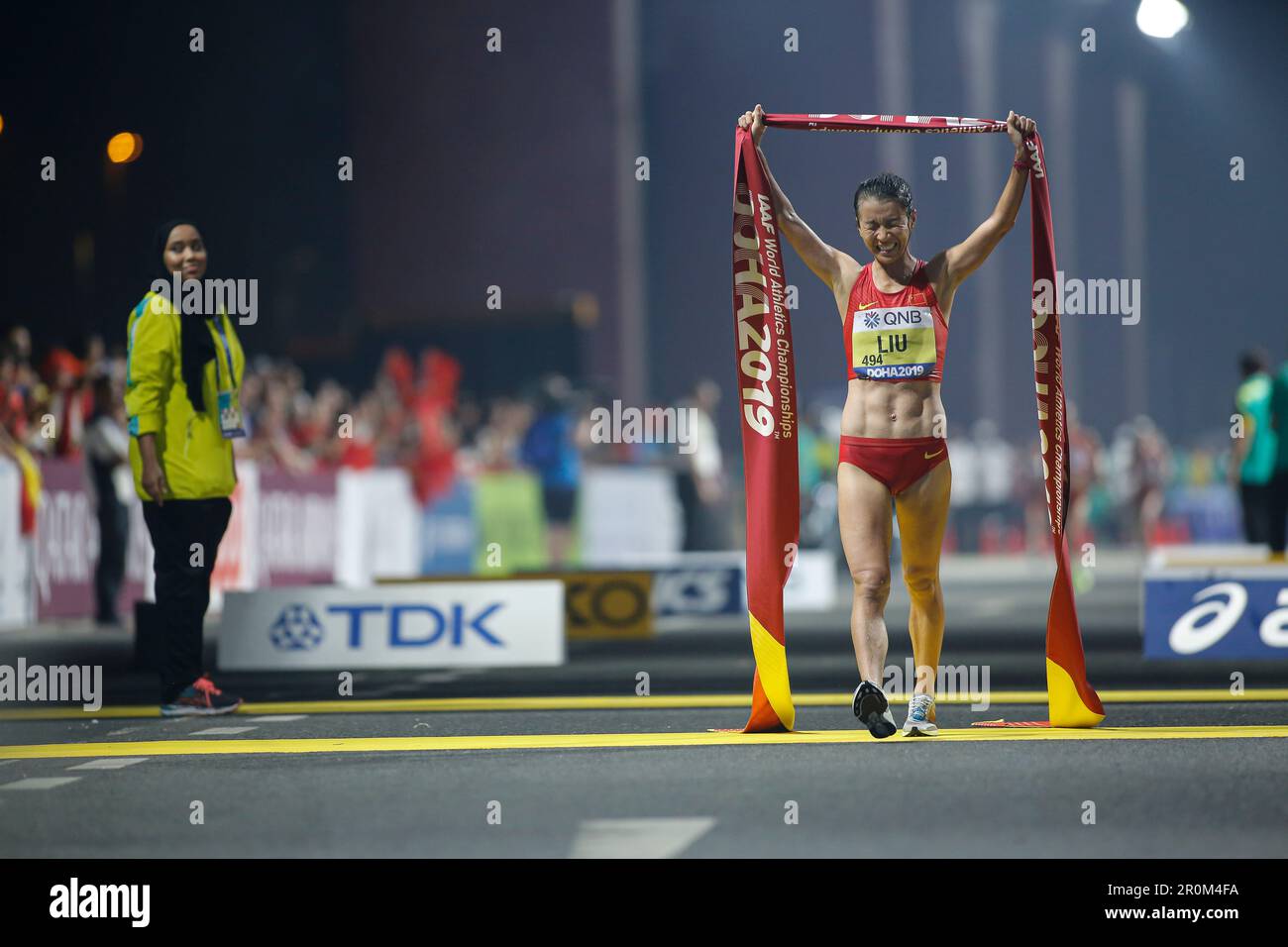 Hong LIU running the 20 Kilometres Race Walk at the 2019 World ...
