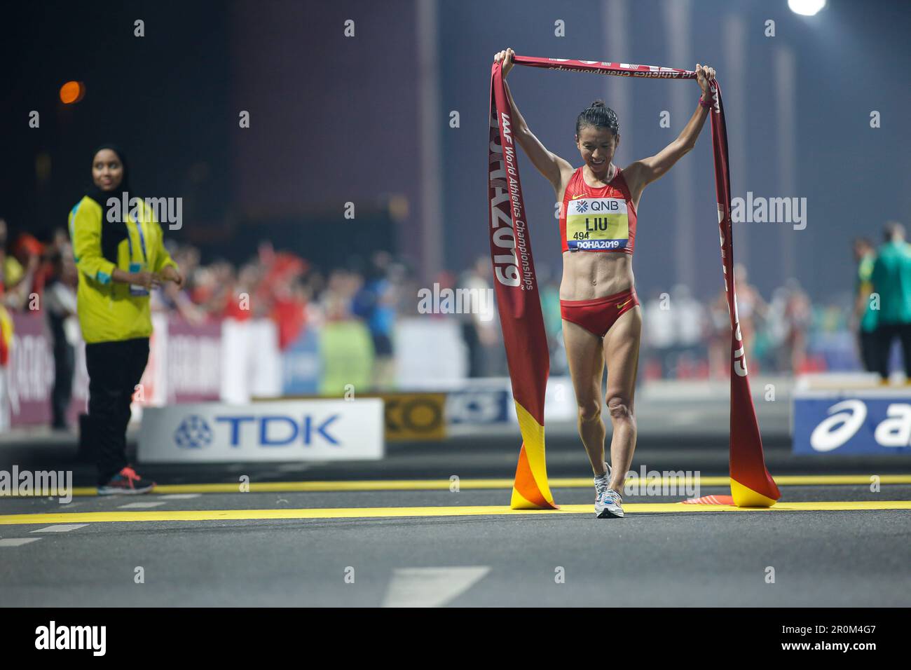 Hong LIU running the 20 Kilometres Race Walk at the 2019 World ...