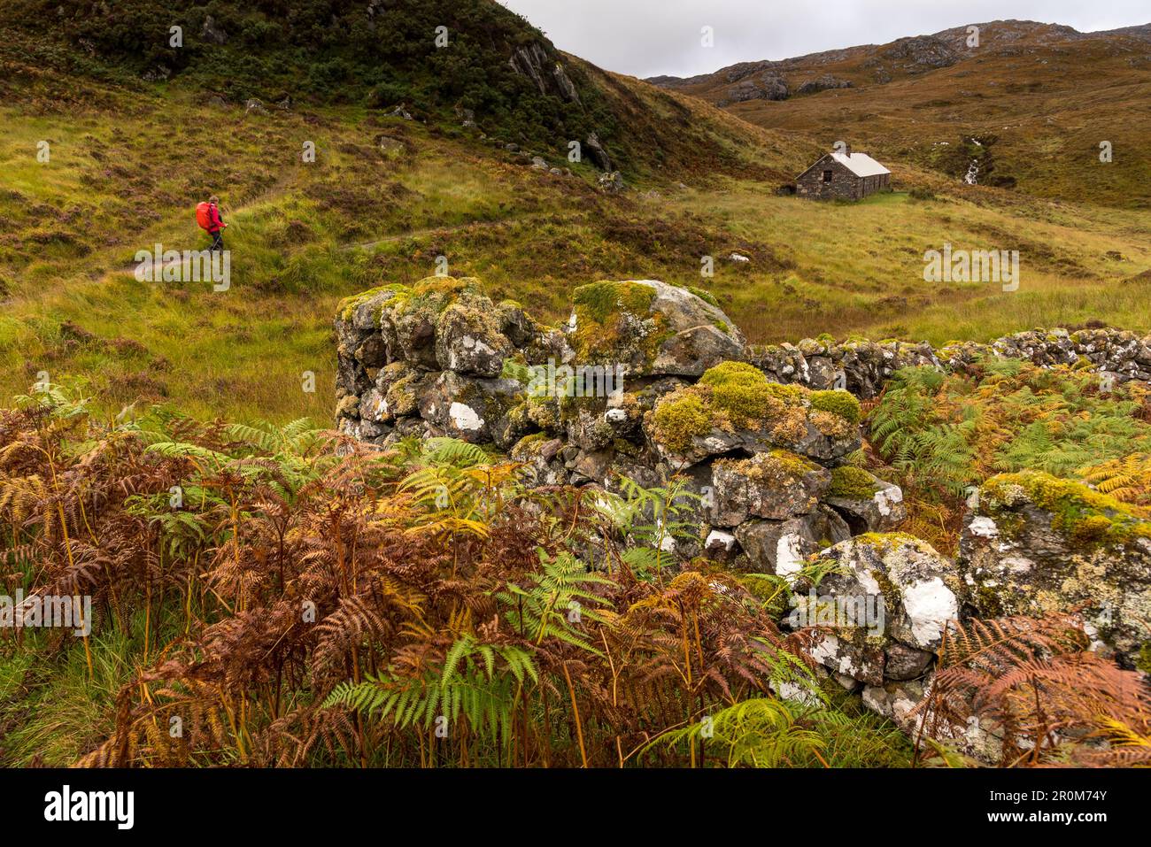 A hiker on arrival at Suileag Bothy, Inverpolly Nature Reserve ...