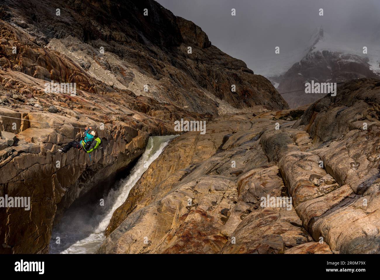 A female hiker crosses the Rio Electrico on a zip line (Tirolesa ...