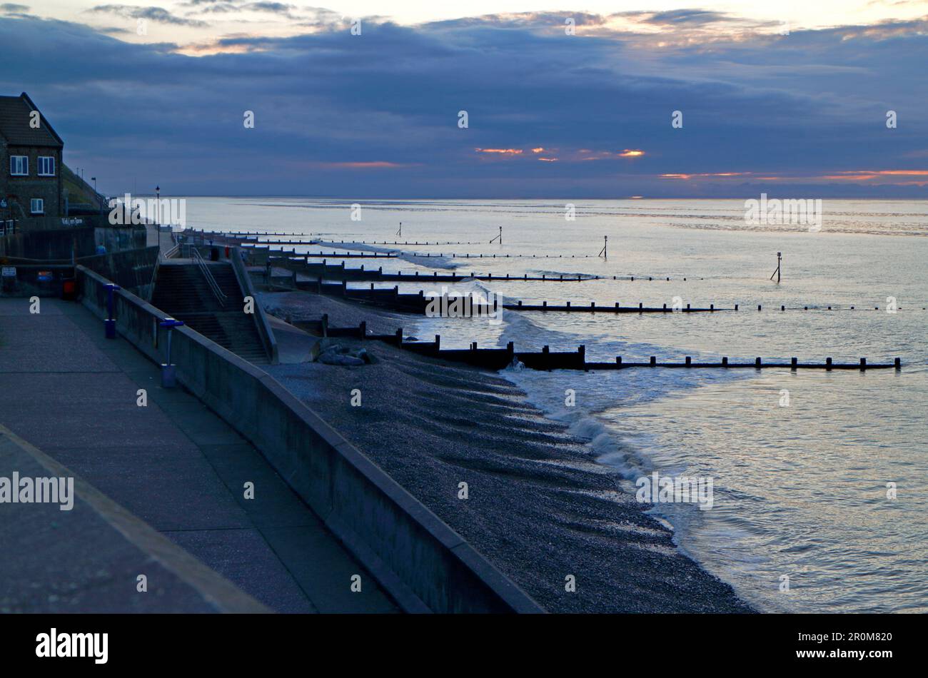 A view westwards from the promenade along the beach and shoreline ...