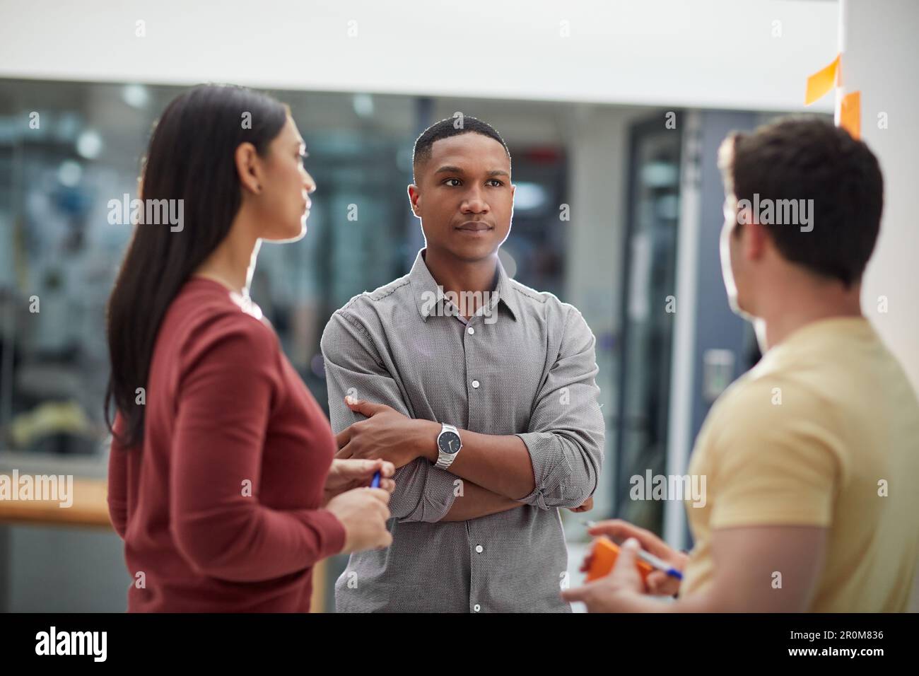 Supporting success with solid teamwork. a group of young businesspeople ...