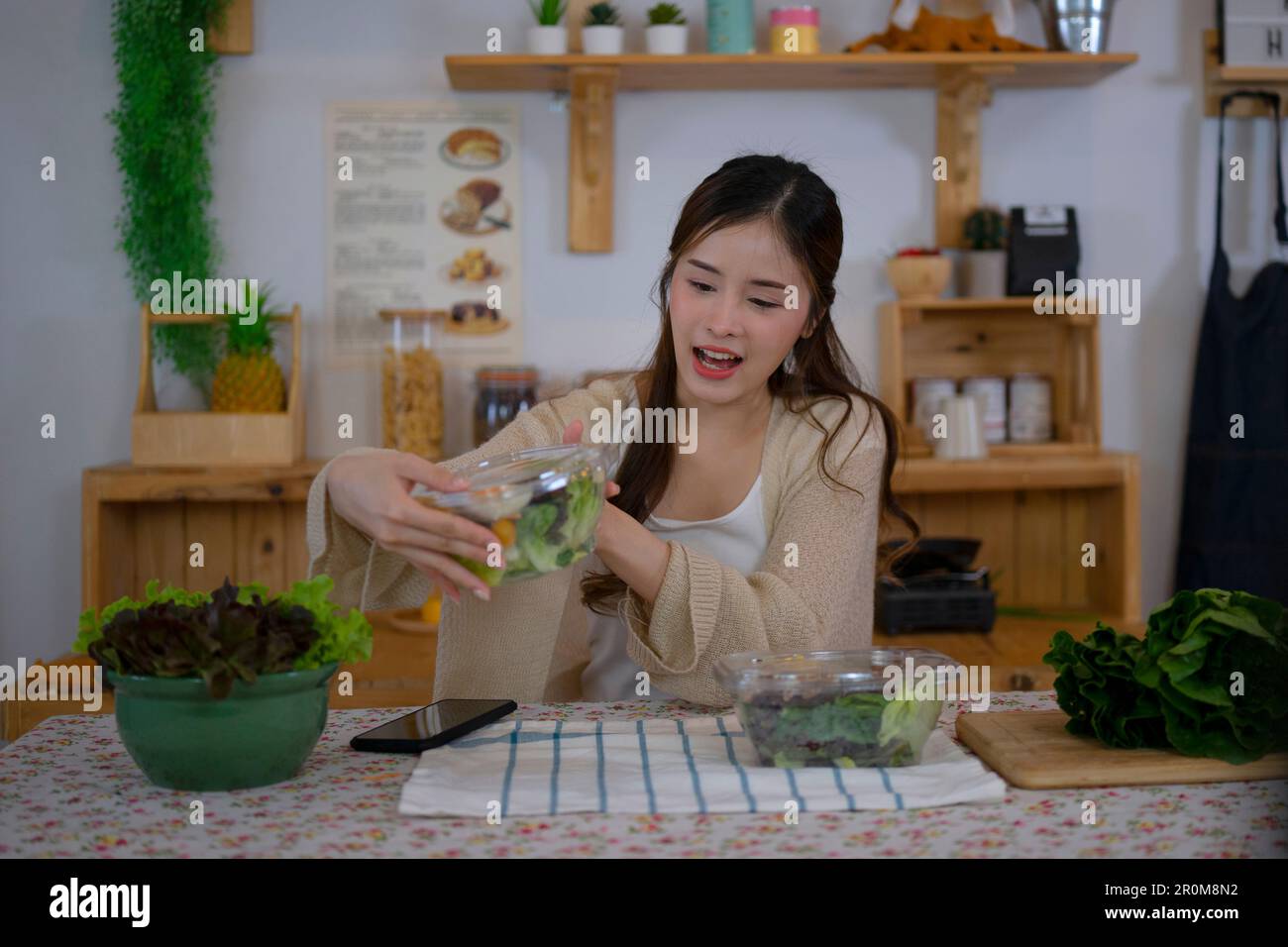 Pretty woman is livestreaming for sell healthy food. Vlogging and ...