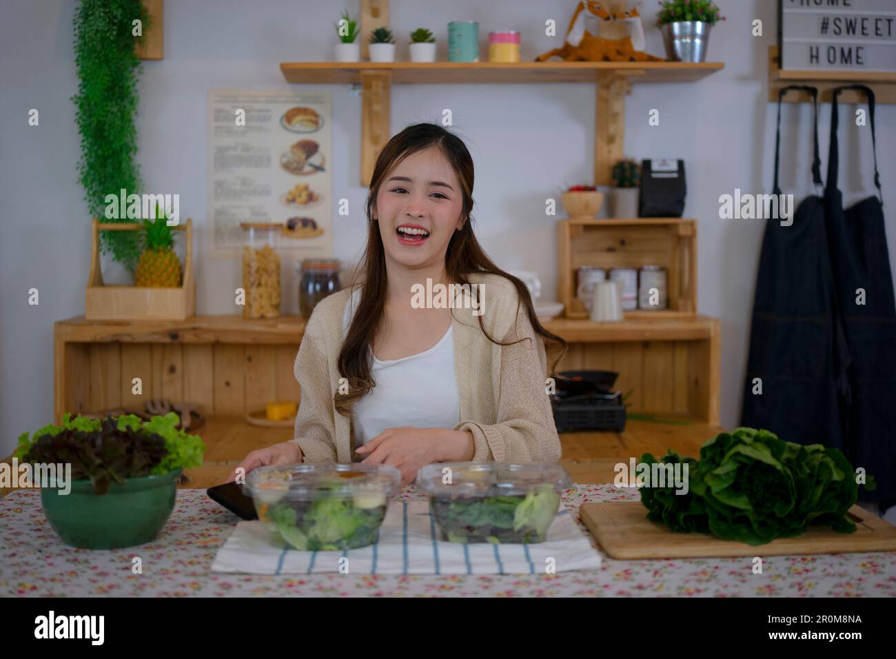 Pretty woman is livestreaming for sell healthy food. Vlogging and ...