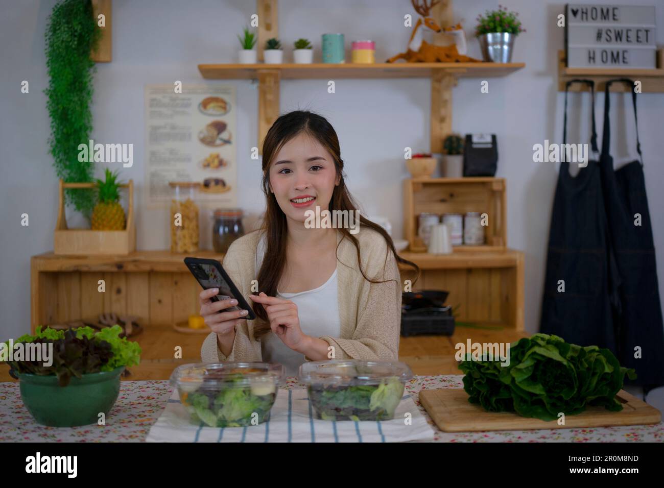 Pretty woman is livestreaming for sell healthy food. Vlogging and ...