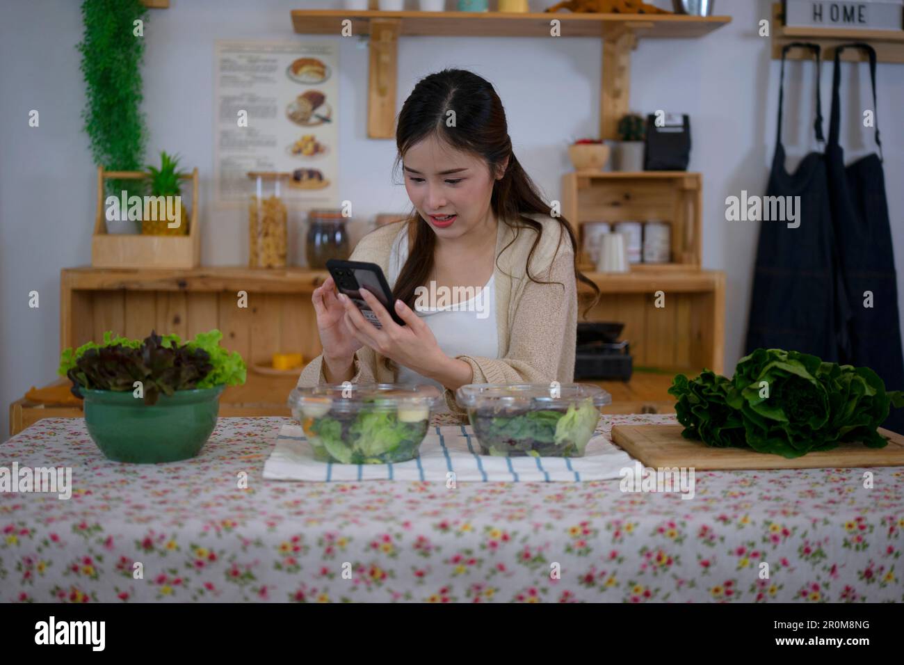 Pretty woman is livestreaming for sell healthy food. Vlogging and ...