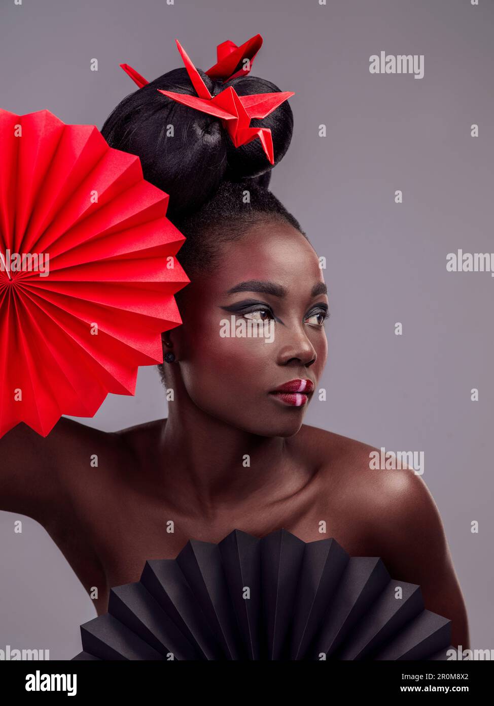Beauty, makeup and origami with black woman in studio for creative, art ...