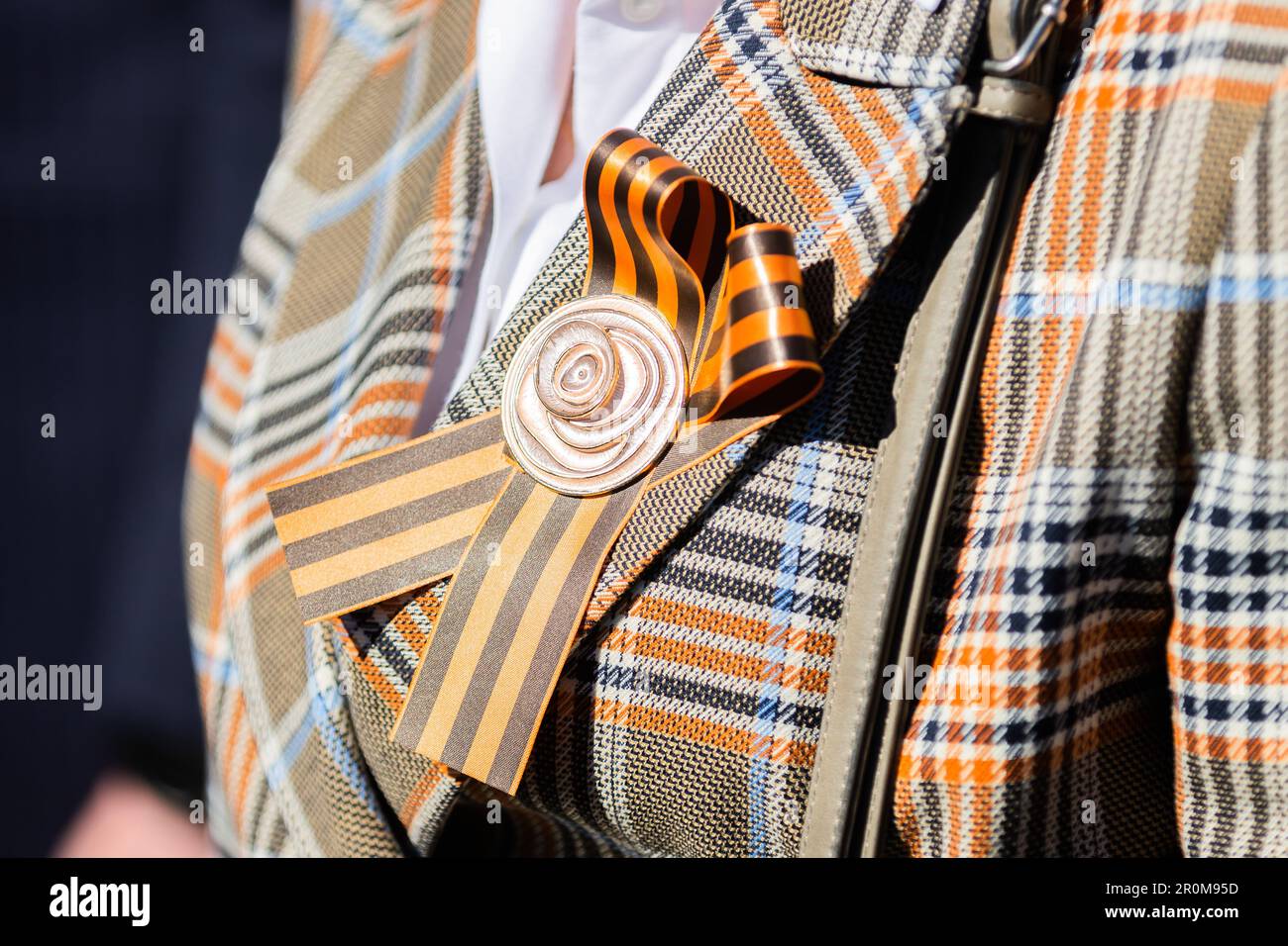 Berlin, Germany. 09th May, 2023. A visitor wears the Saint George ...
