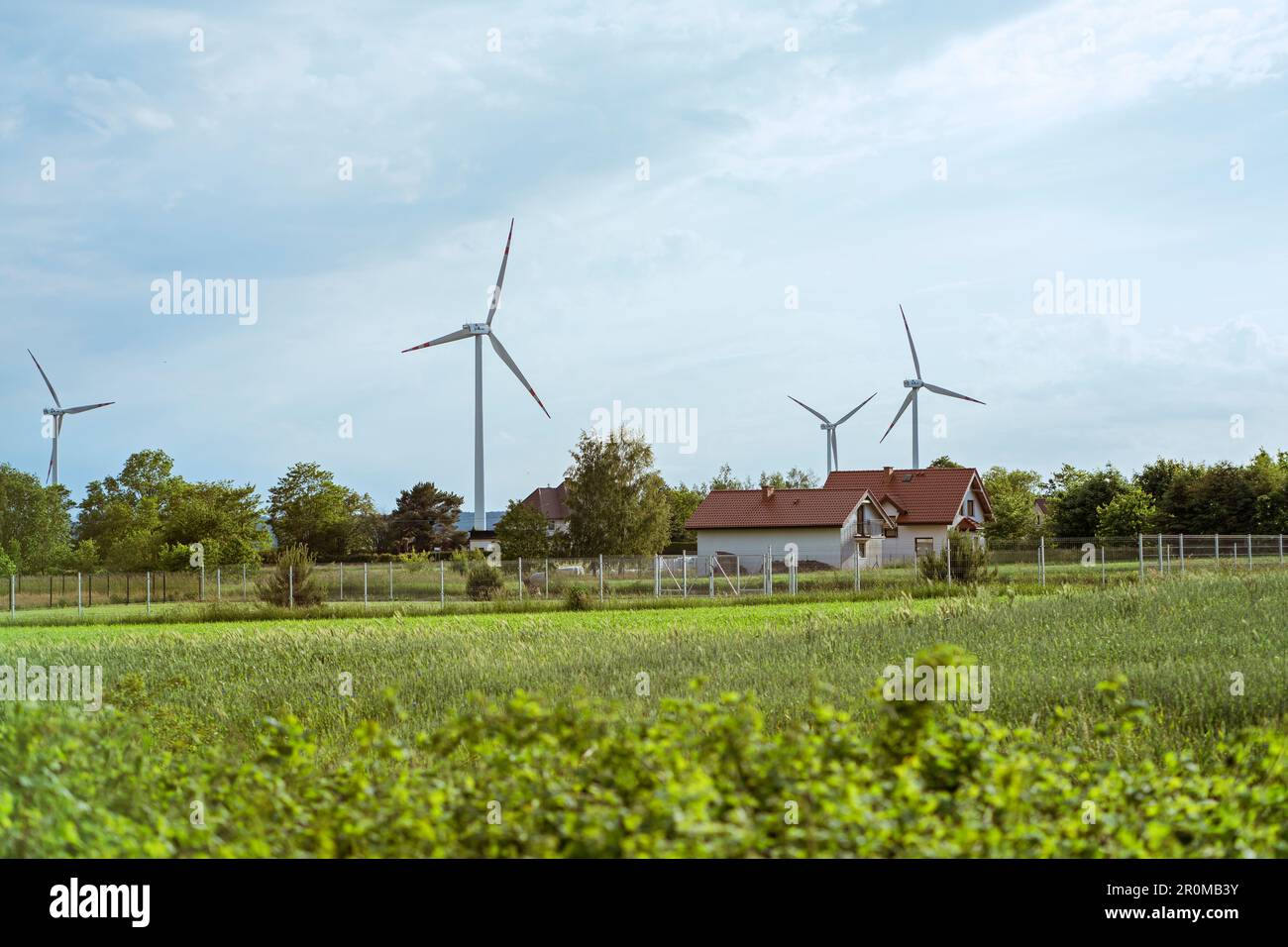 Wind farms against the backdrop of a beautiful blue sky with clouds and ...