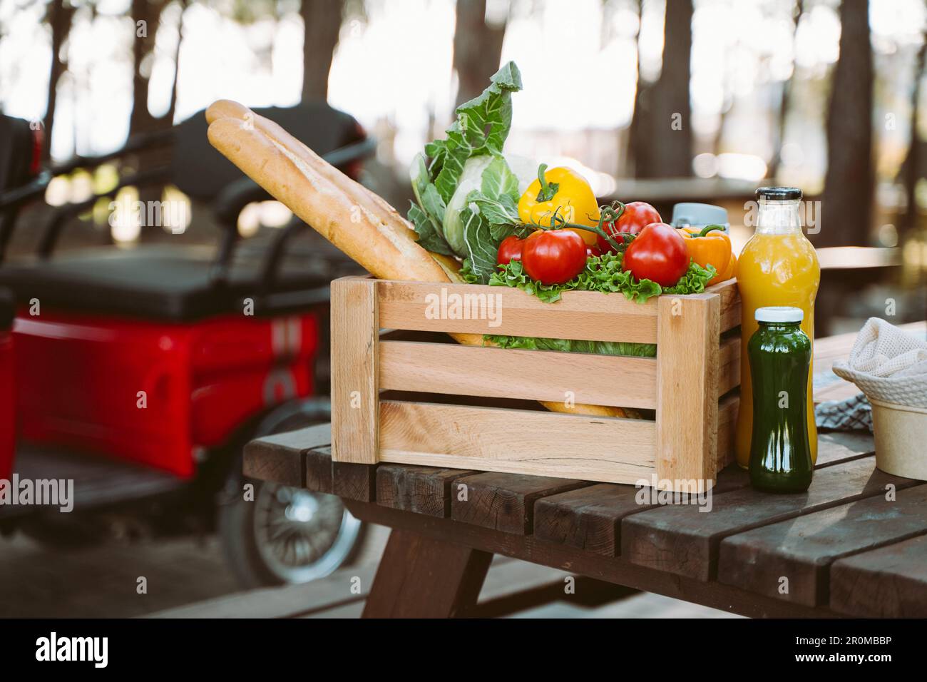 Wooden crate organic farmland vegetables, bread baguettes, fruits ...