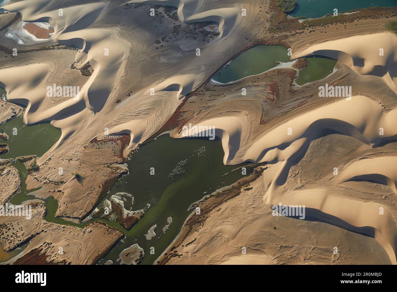 Walvis Bay lagoon and Namib desert dunes from the air, Namibia Stock ...