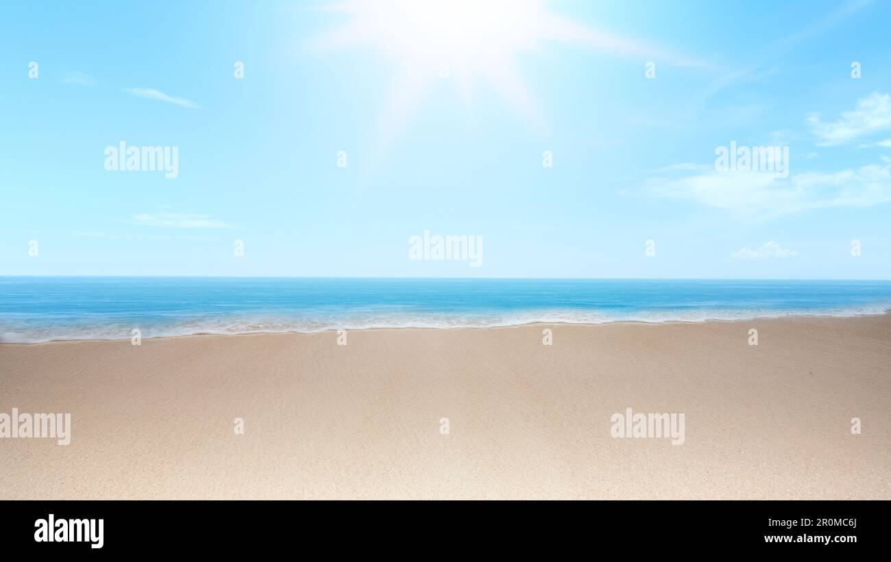 Sandy beach with the blue ocean and blue sky background Stock Photo - Alamy