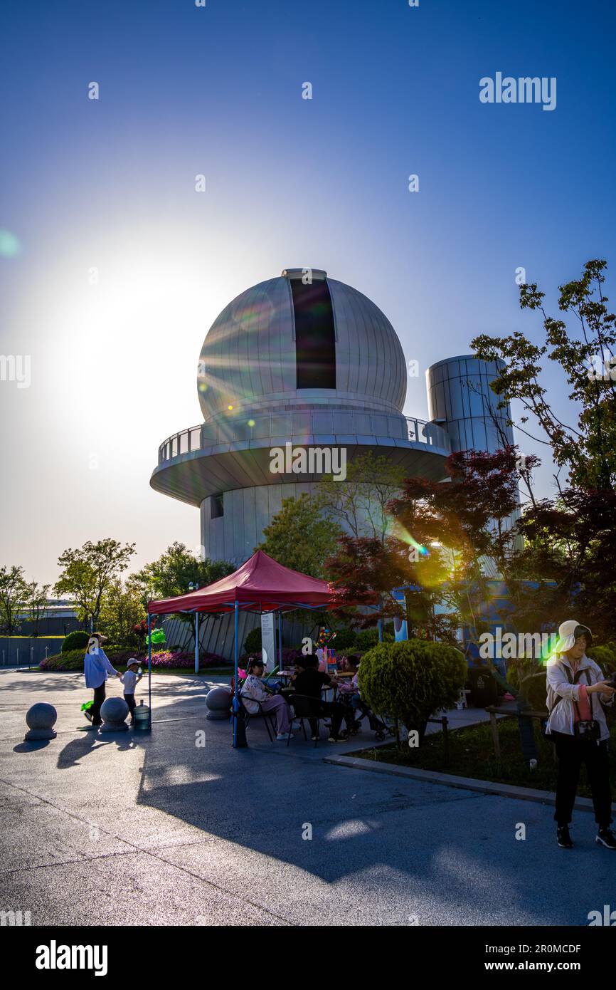 Sun flare from the setting sun behind the Wangshu Observatory at the ...