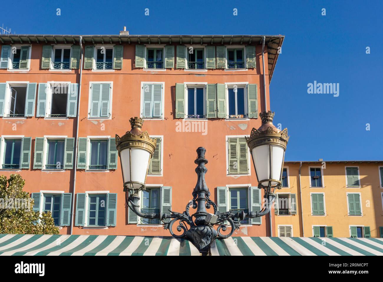 Typical facades at the flower market in the old town of Nice, France ...