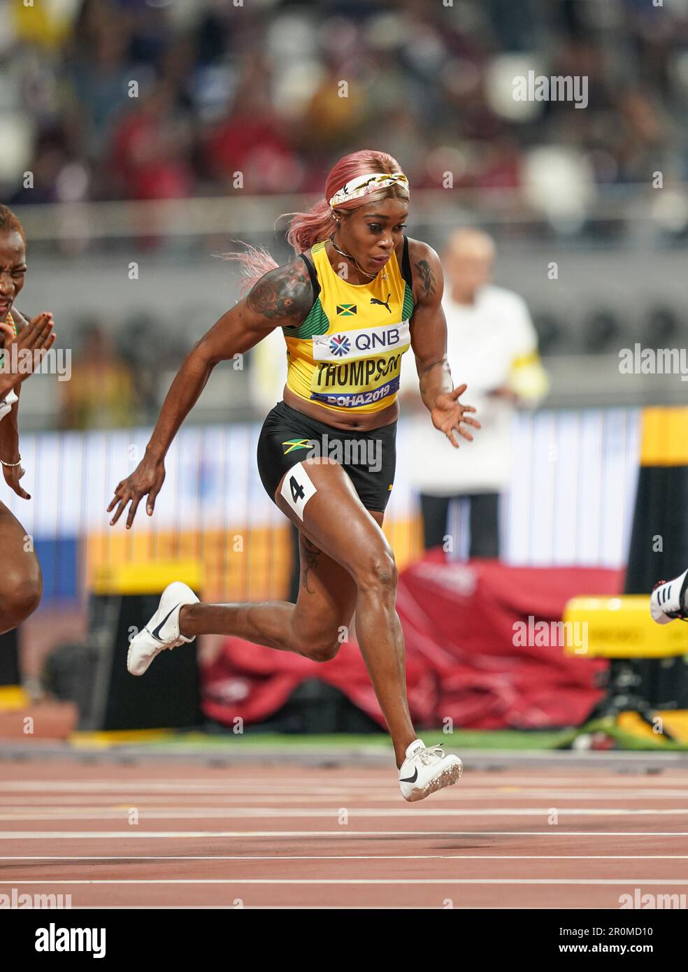Elaine Thompson running the 100m at the 2019 World Athletics ...