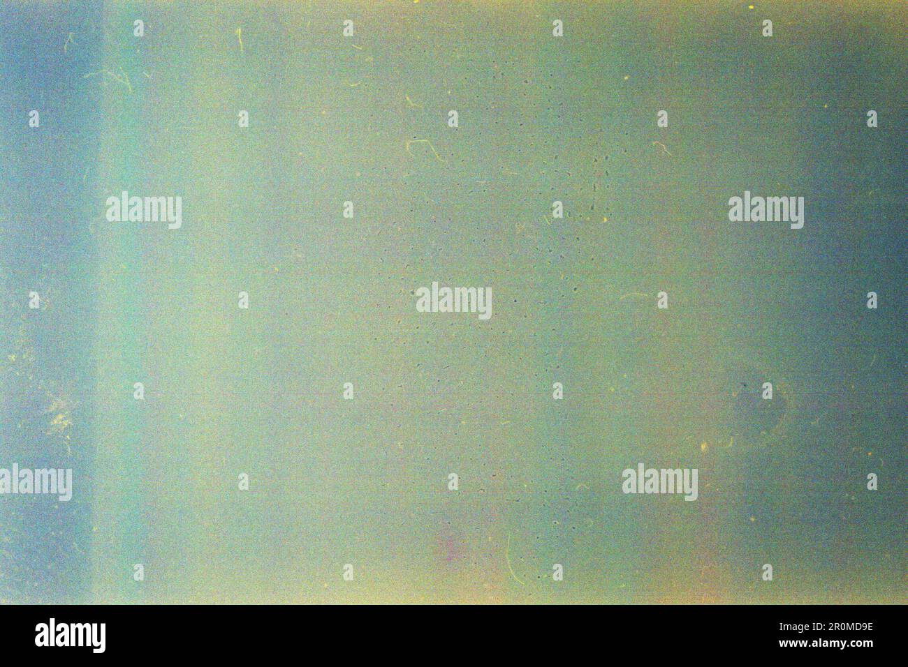 Abstract toned film texture background with grain, dust and light leak ...