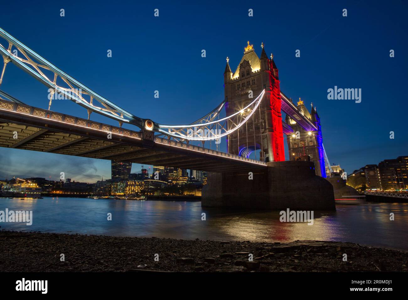 Tower Bridge with coloured lighting to celebrate the coronation of King ...