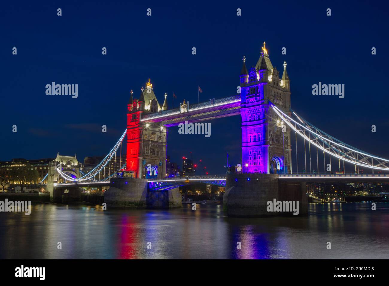 Tower Bridge with coloured lighting to celebrate the coronation of King ...