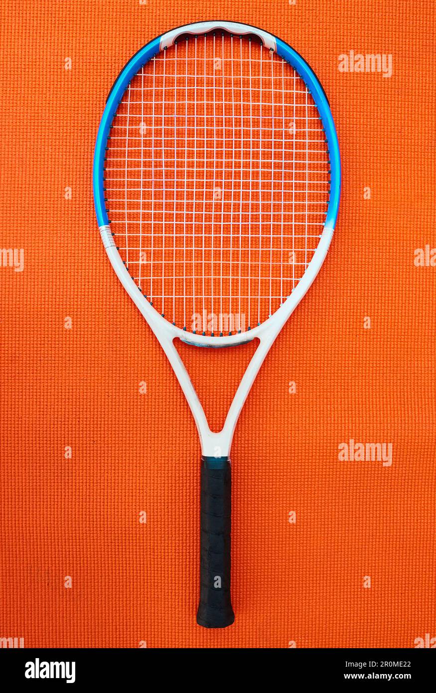 The best of its kind. High angle shot of a single tennis racket placed ...