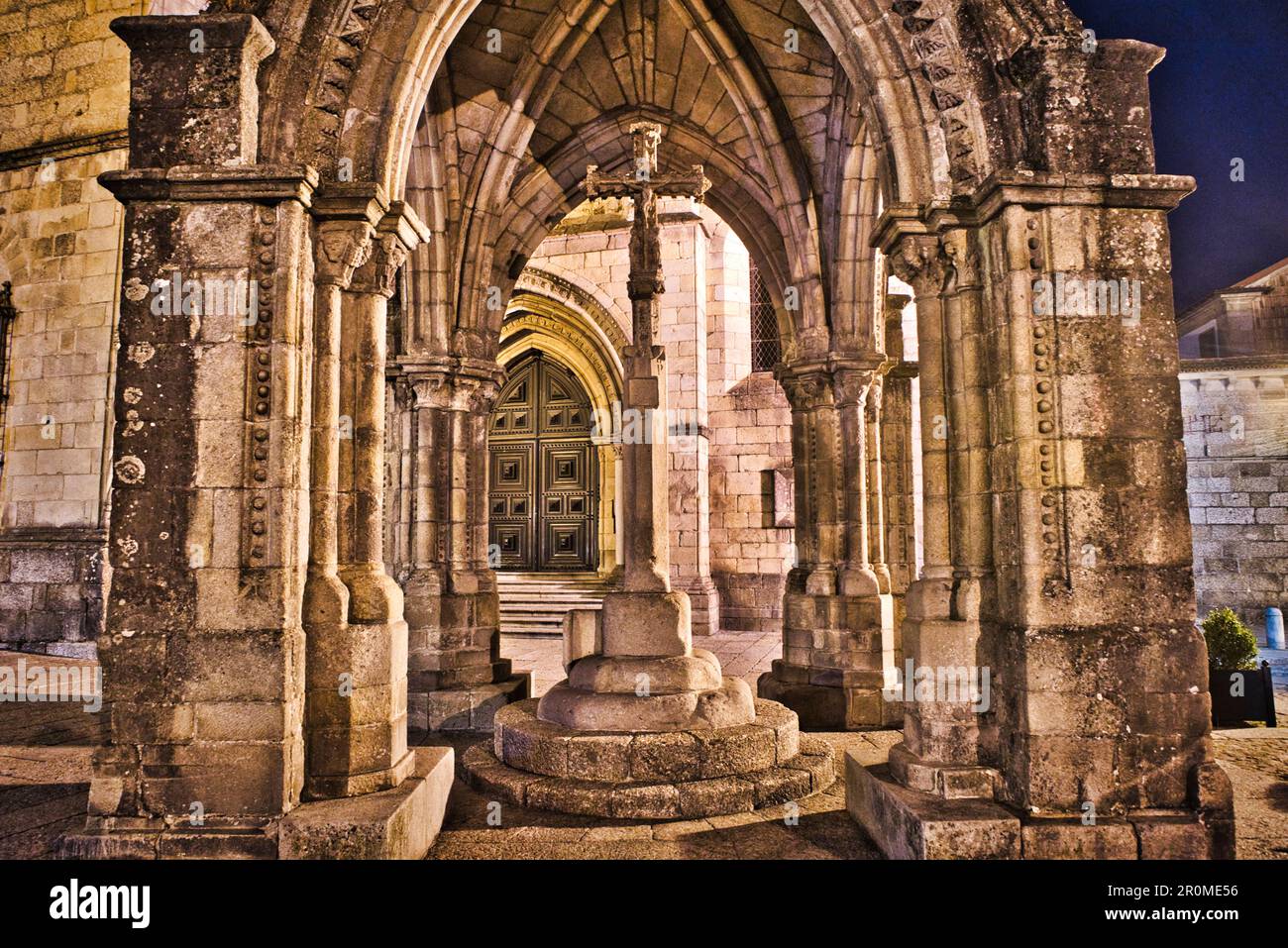 Cross in front of the Nossa Senhora da Oliveira church at night, Largo ...