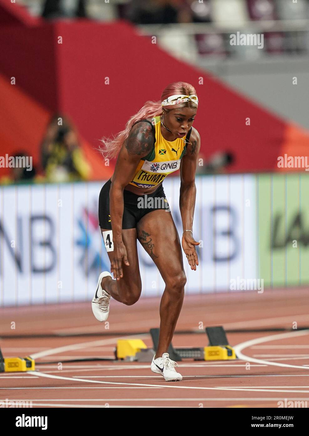Elaine Thompson running the 100m at the 2019 World Athletics ...