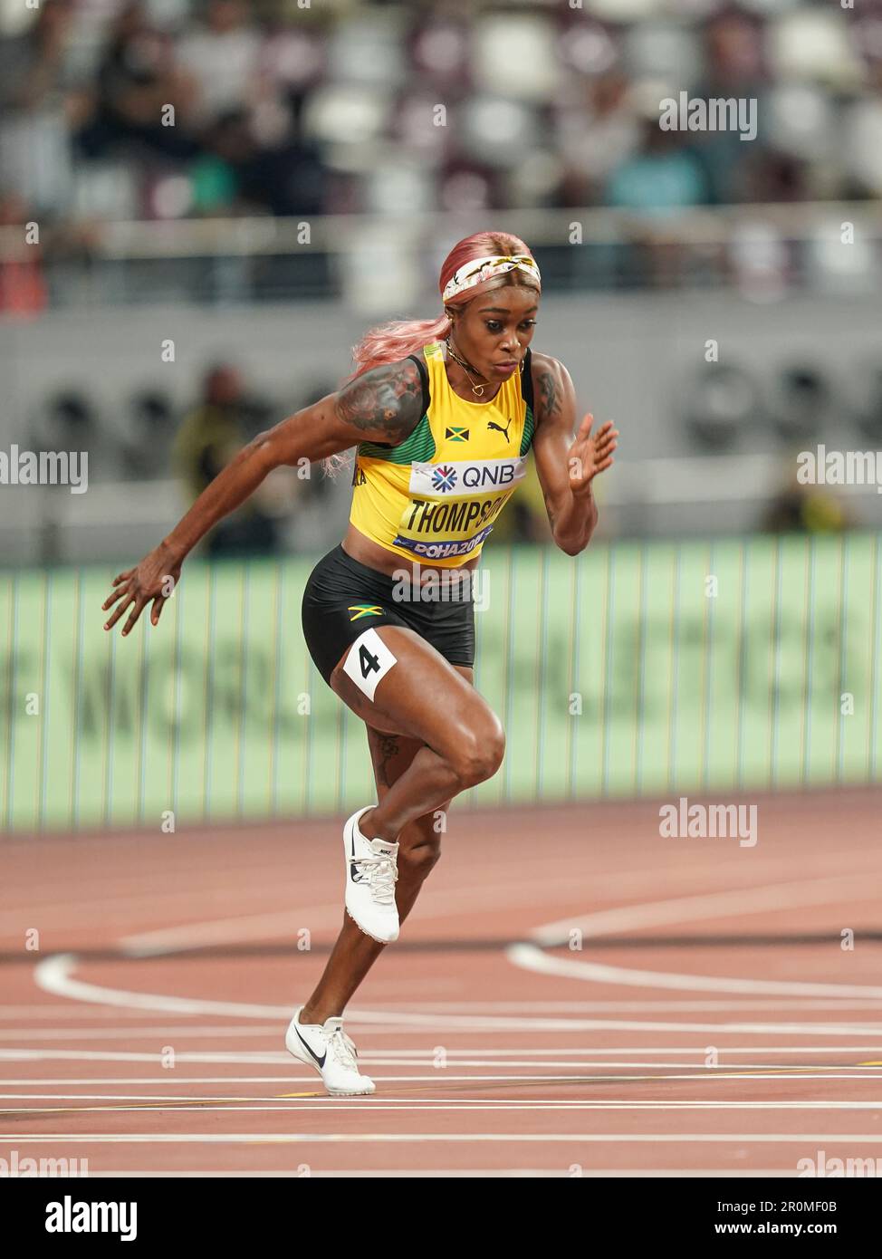 Elaine Thompson running the 100m at the 2019 World Athletics ...