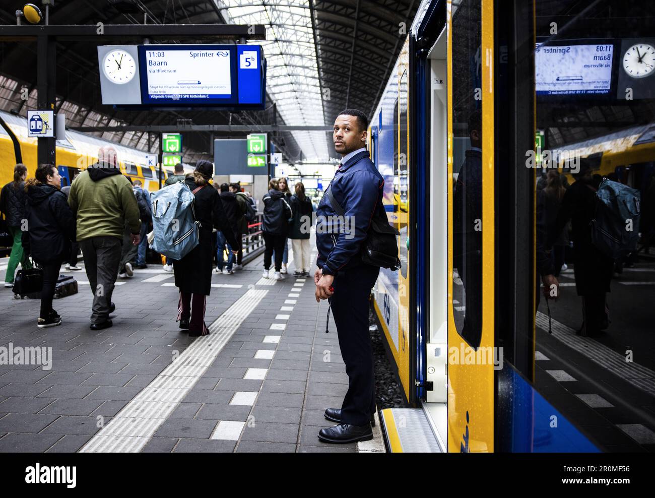 AMSTERDAM - A conductor of the new Sprinter at Amsterdam Central. A ...