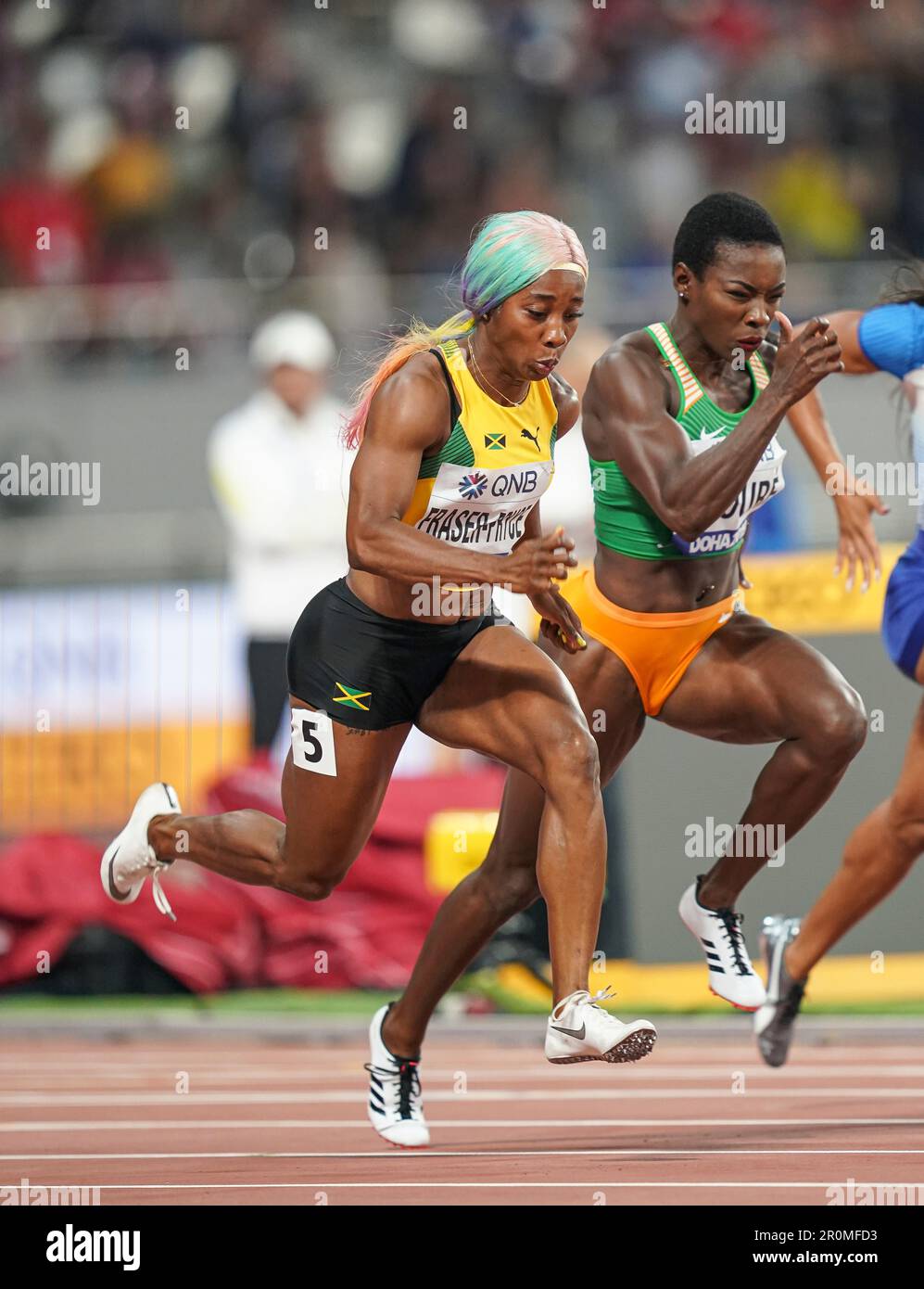 Shelly-Ann Fraser-Pryce running the 100m at the 2019 World Athletics ...
