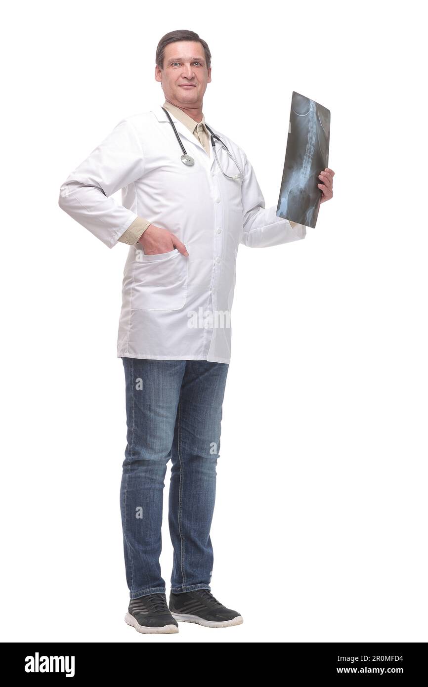 Attractive doctor examining an x-ray and looking at the camera Stock ...