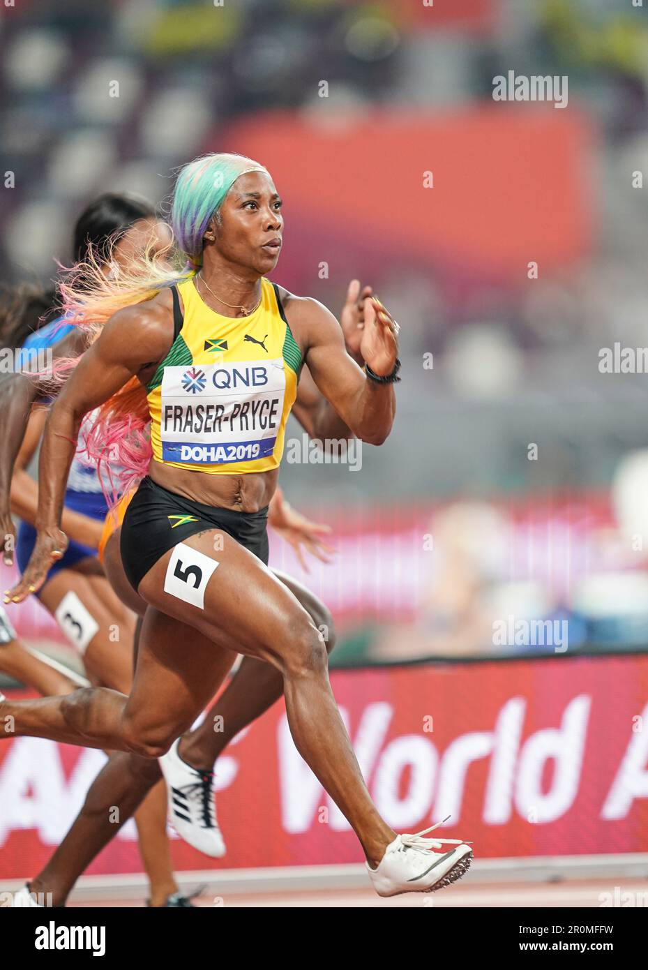 Shelly-Ann Fraser-Pryce running the 100m at the 2019 World Athletics ...