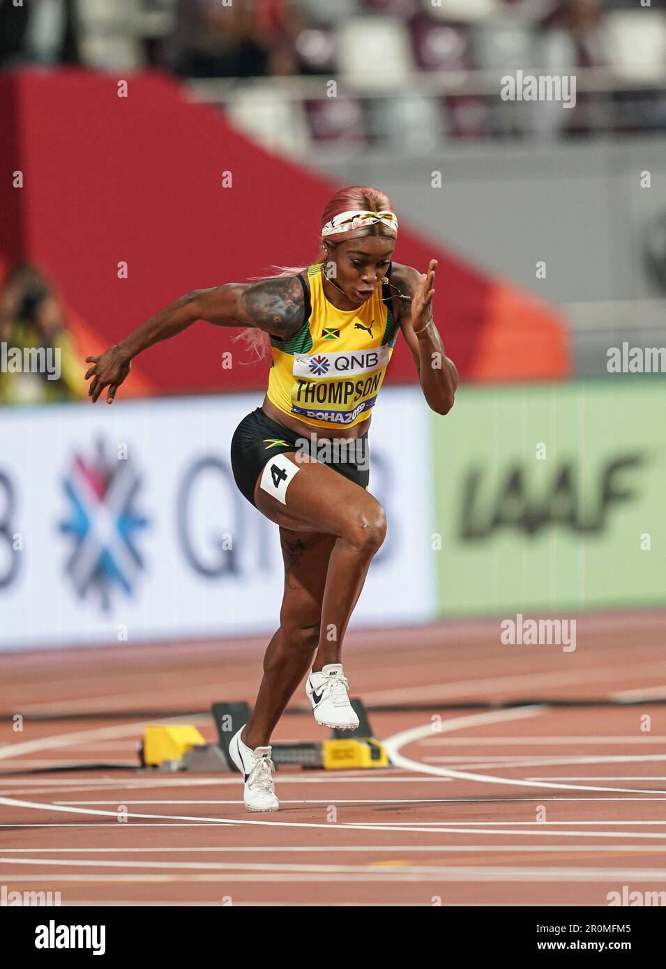 Elaine Thompson running the 100m at the 2019 World Athletics ...