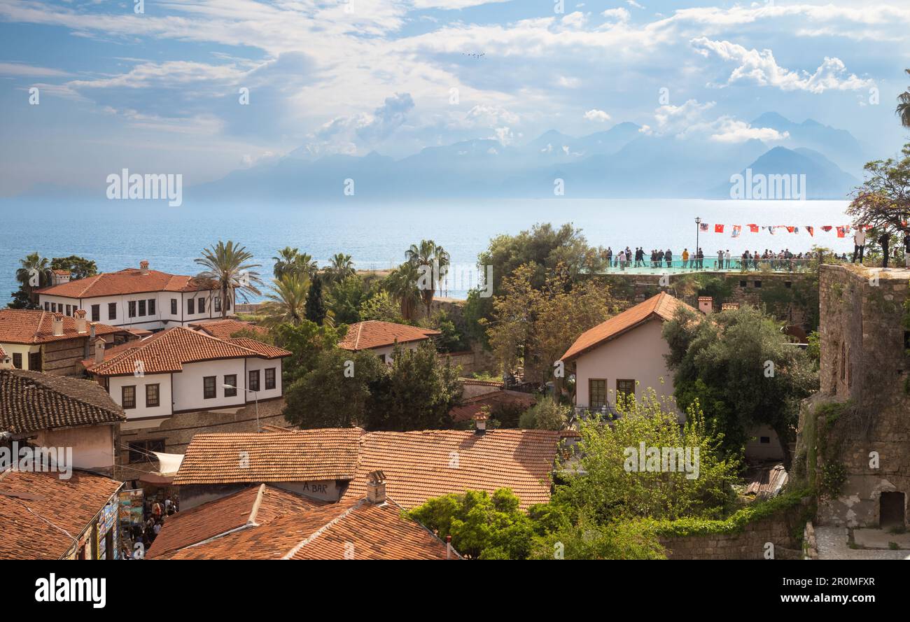 People stand on a viewing platform built on top of the city walls to ...