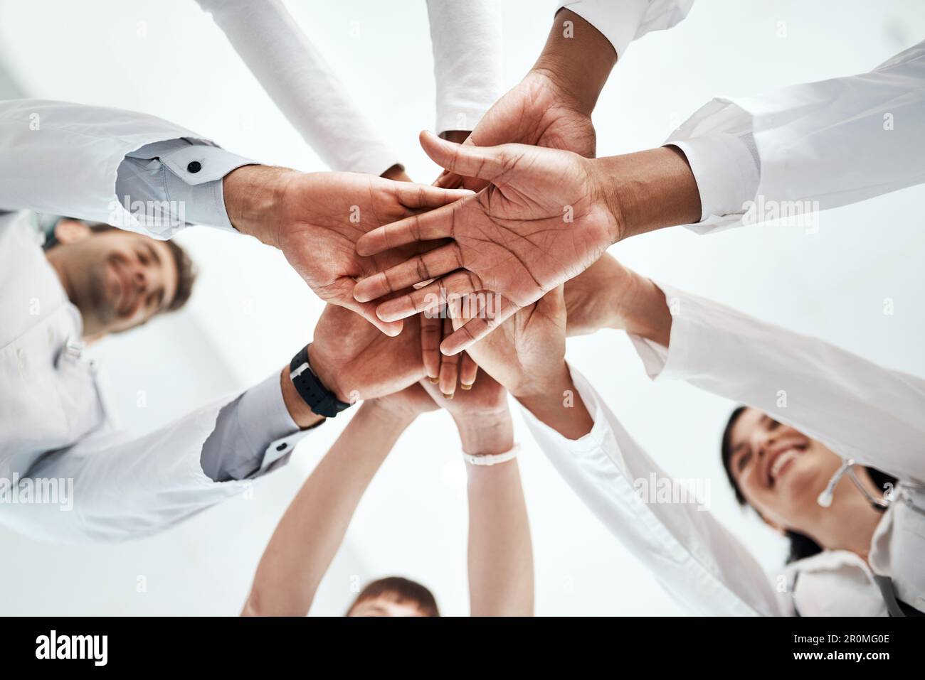 We promise to put our patients first. Low angle shot of a diverse team ...