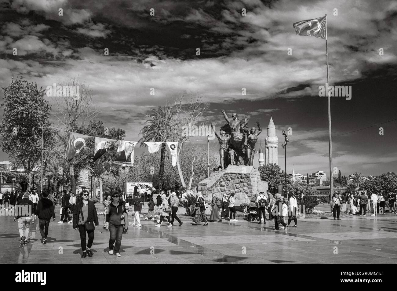 People stroll in Republic Square next to the statue of national hero ...