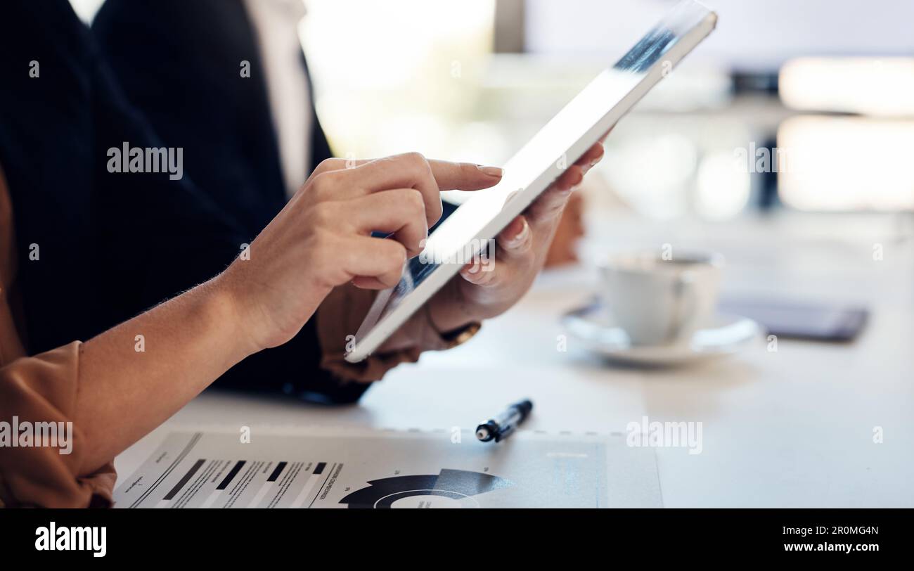 The ideal minute taking tool. a businesswoman using a digital tablet ...