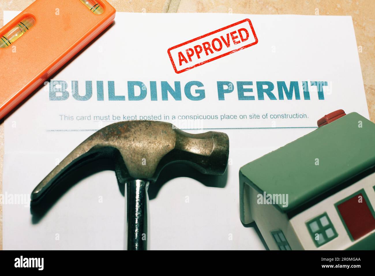 Building Permit concept with “approved” text on a residential home ...